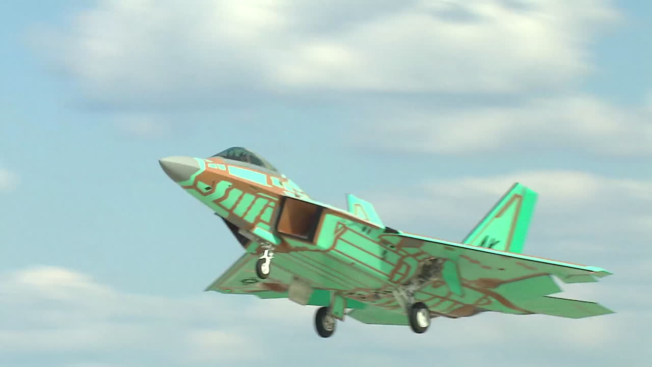 Green Camouflaged F15 Jet Aircraft Taking Off From A Military Base Free ...