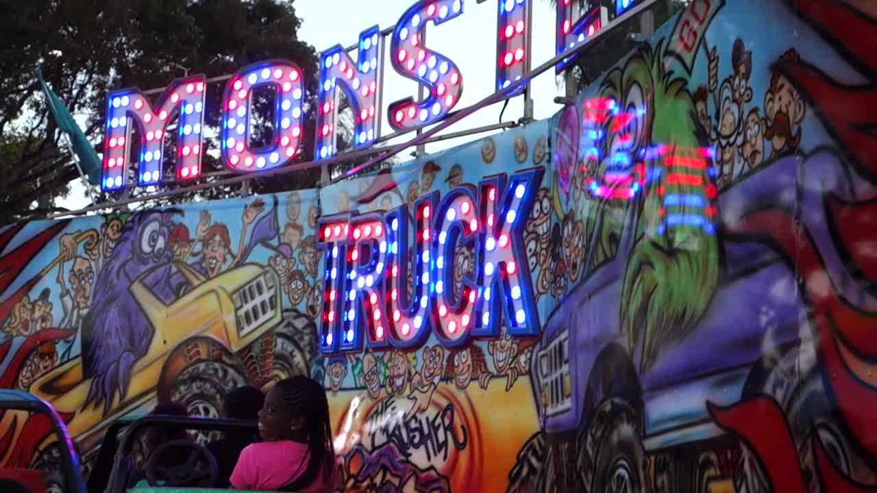 Four Wheel Drive Trucks Go In A Circle On A Merry Go Round At A Circus ...