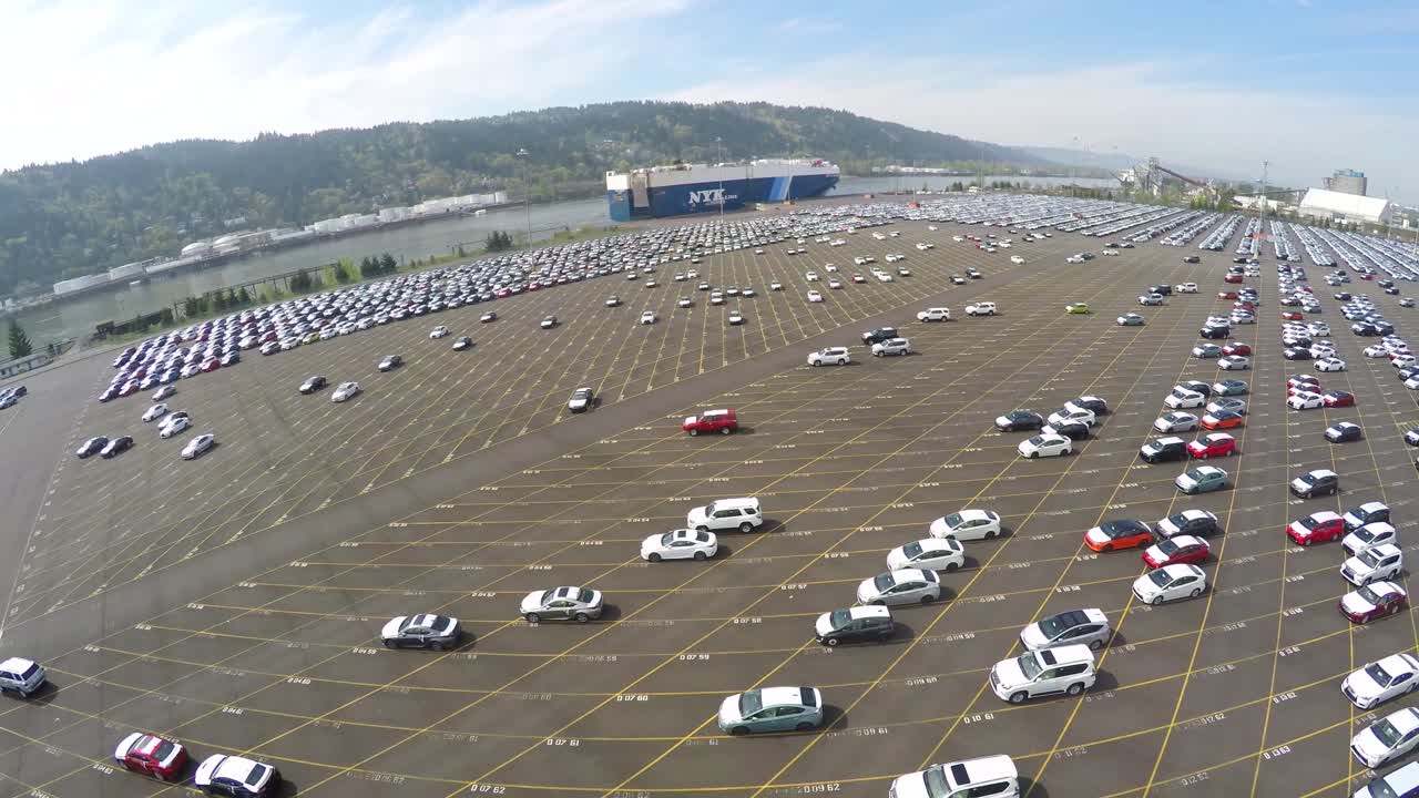 An Aerial Over Vast Mostly Empty Parking Lots At A Shipping Container ...
