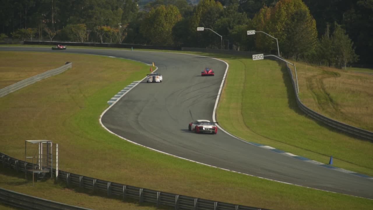 Multiple Race Cars Approaching A Corner Free Stock Video Footage ...