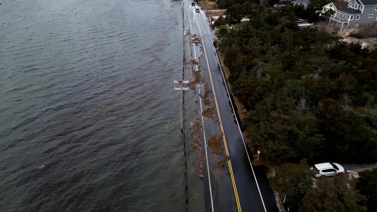 Drone Footage Showing Cars Driving The Rising Floodwaters Waves Breach ...