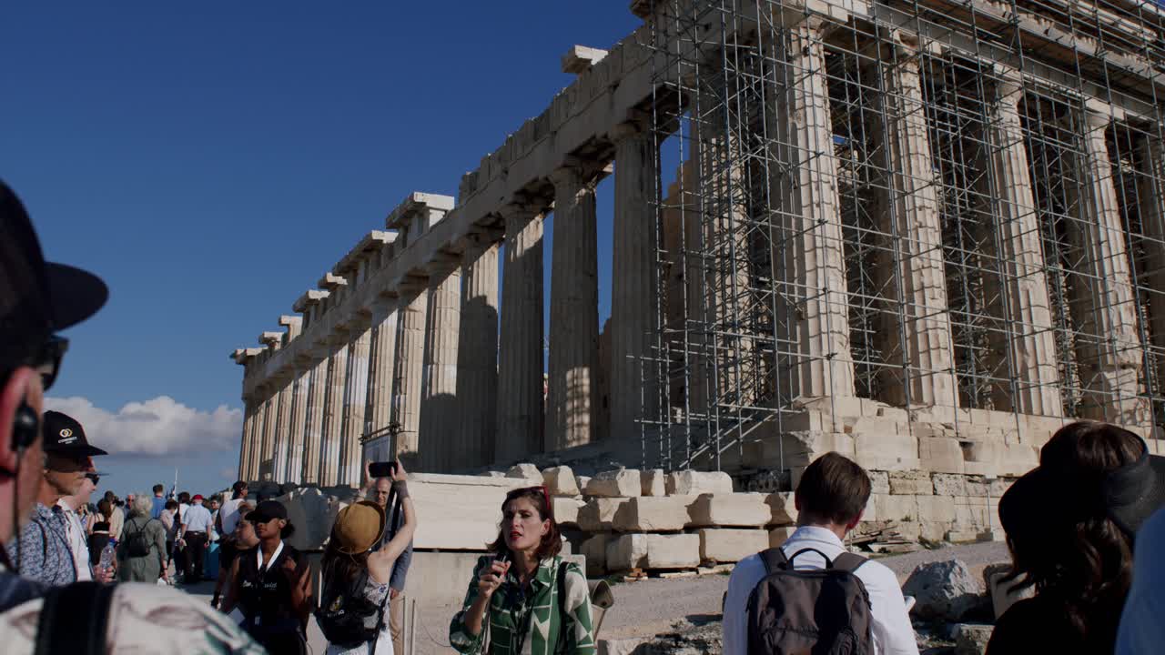 Tourists Visiting The Historical Parthenon Temple, Woman Introducing The Temple With A Video ...