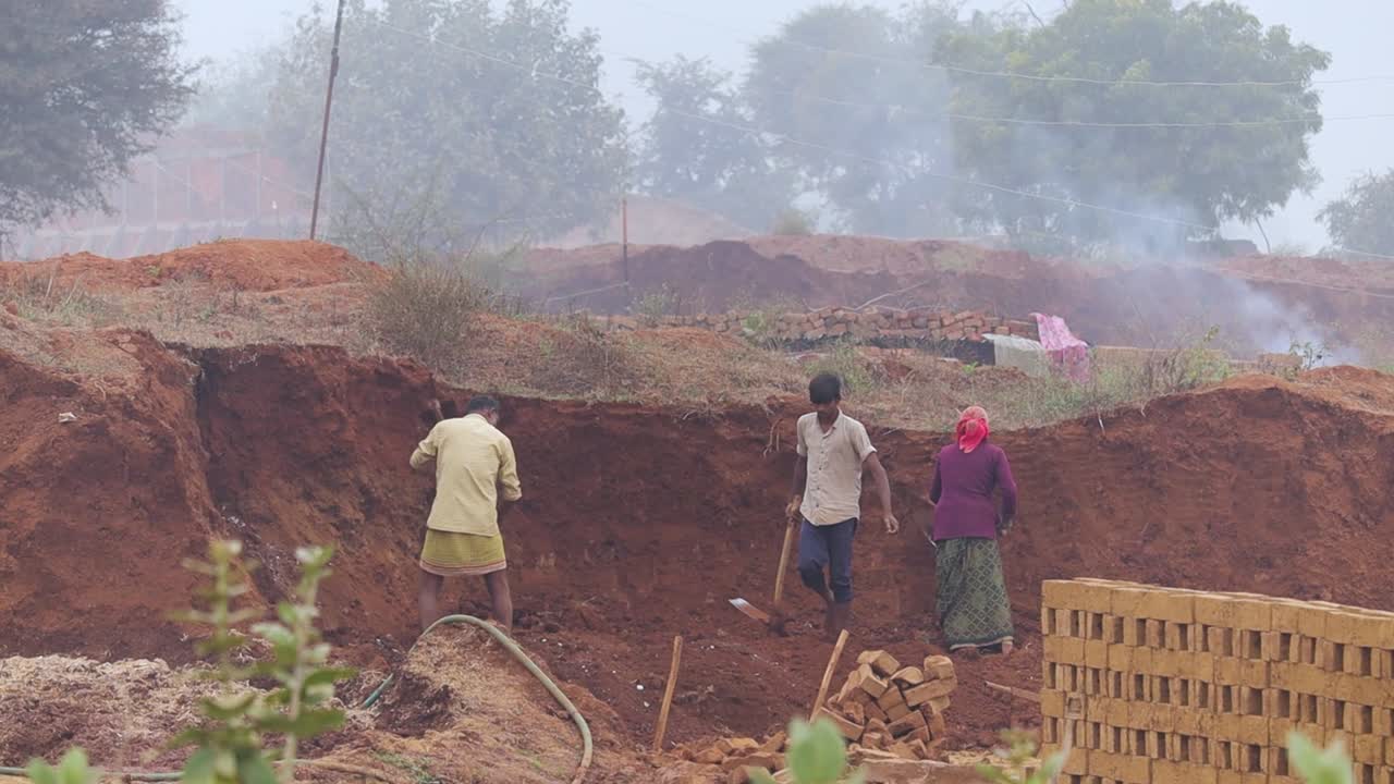 Workers Collecting Soil For Brick Making At A Klin In A Rural Village ...