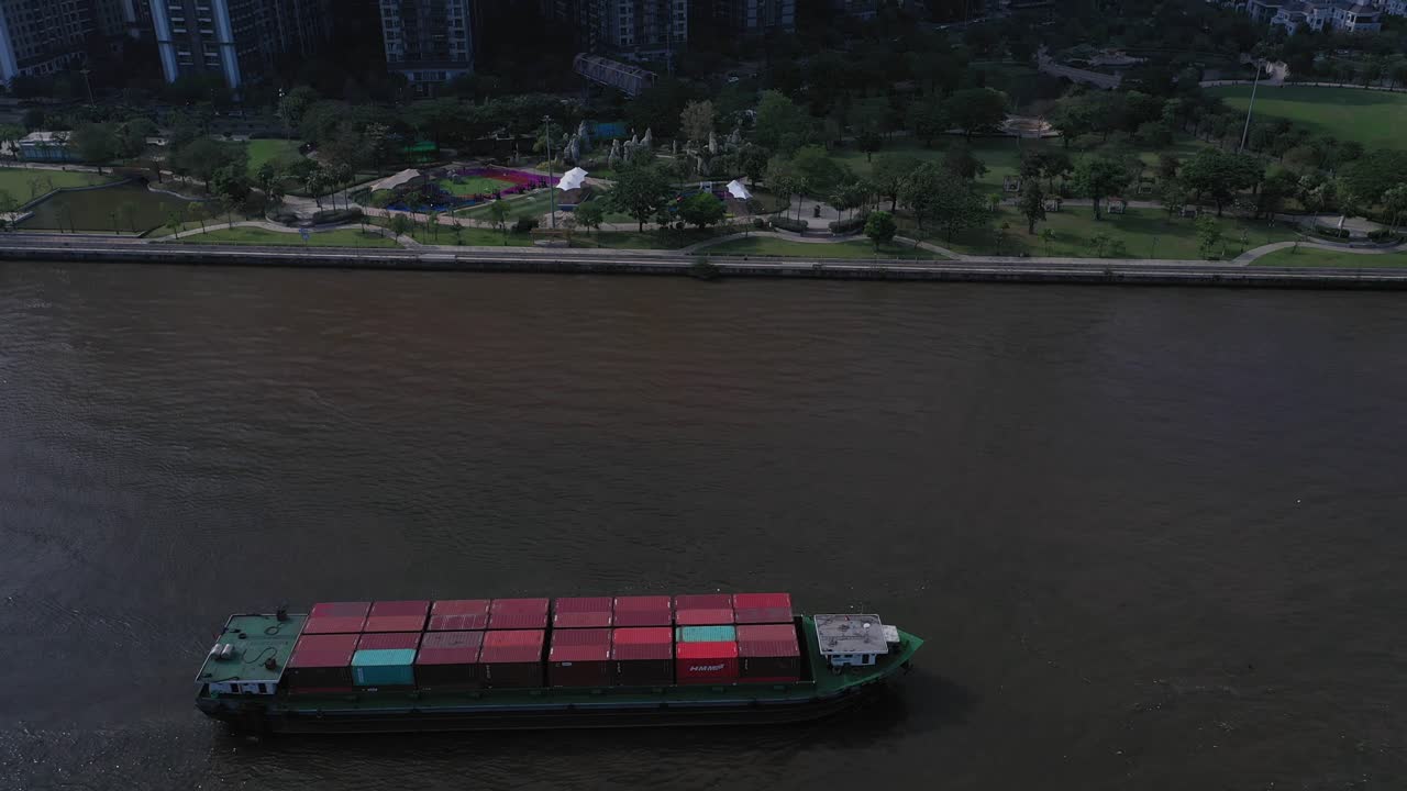 Container Barge On Saigon River Passing High Rise Development Free ...