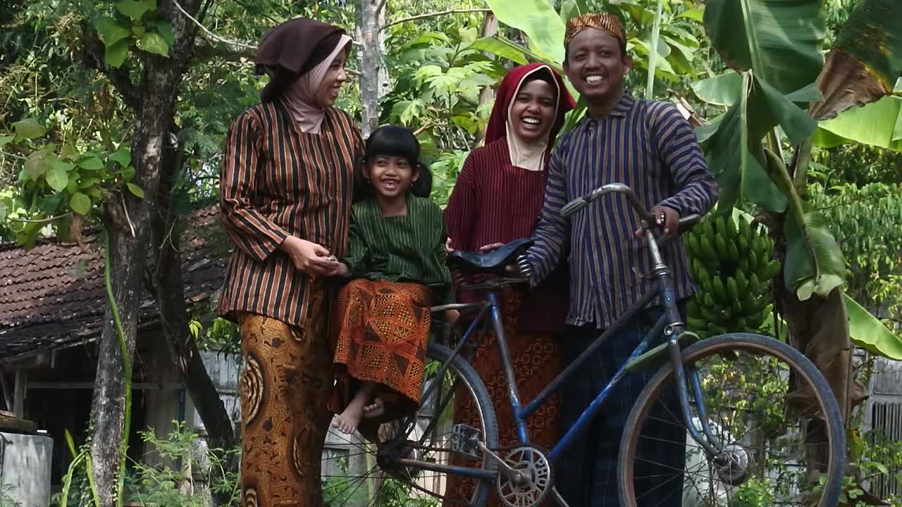 Javanese Family With Their Two Children On An Ancient Bicycle, Central ...