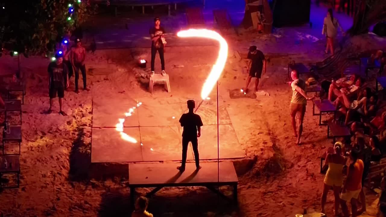 Tourists At Thai Beach Party Drinking And Taking Turn Skipping Fire ...