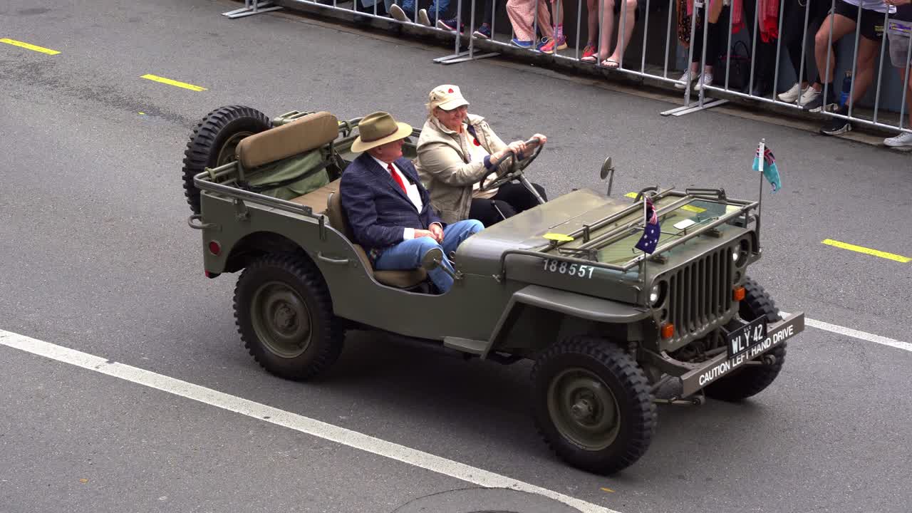 Veteran Riding On Military Willys Jeep Riding Down The Street, Followed ...