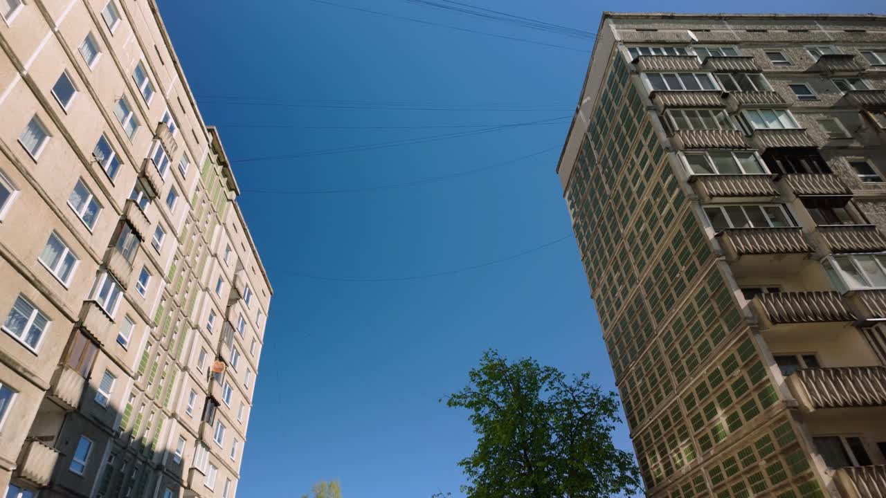 Low Angle Forward Movement Footage Of Soviet-era Apartment Blocks In ...