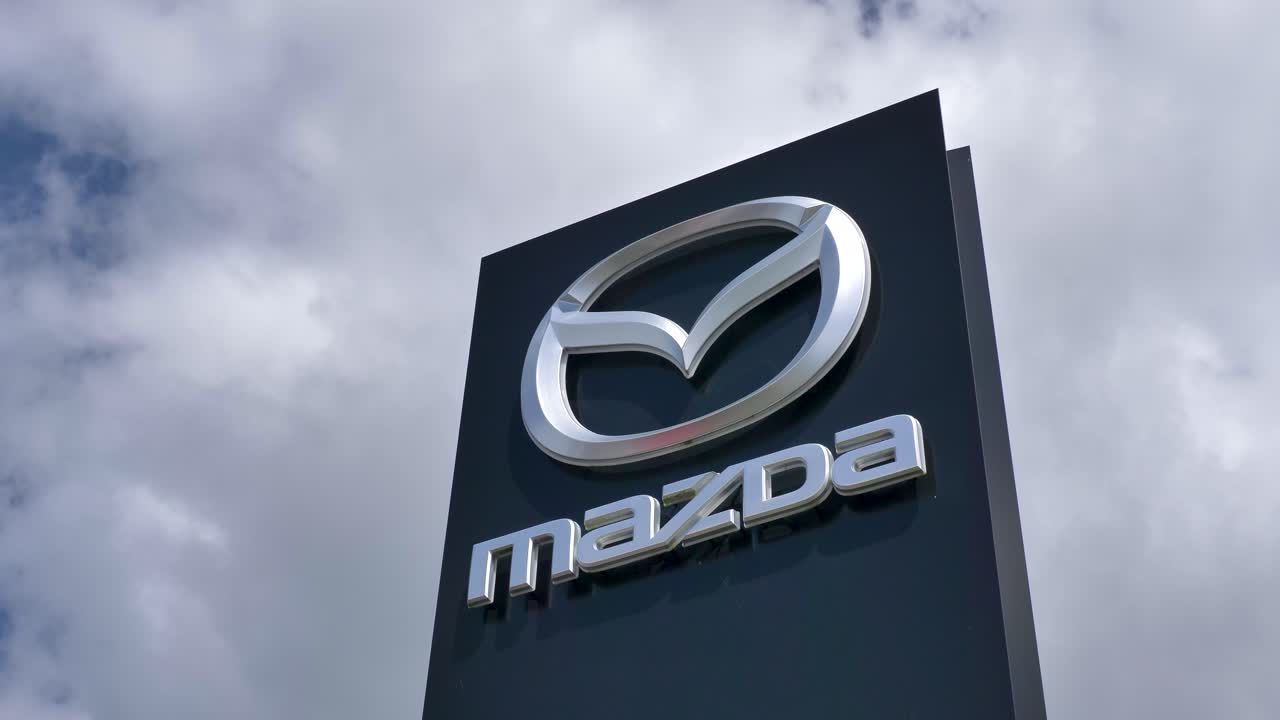 Mazda Logo On Sign With Cloudy Sky Backdrop, Exeter, Devon, UK, June ...