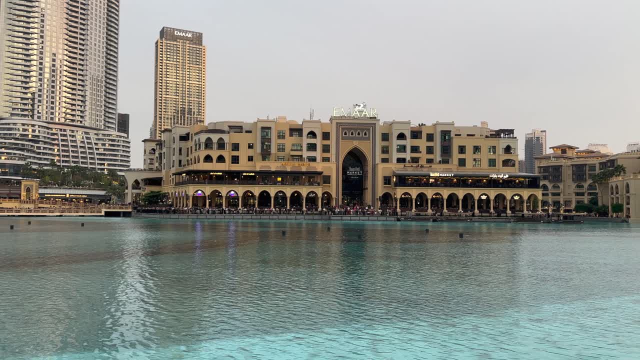 Pan Across Burj Khalifa Lake, Emaar Market And Dubai City Skyline Free ...