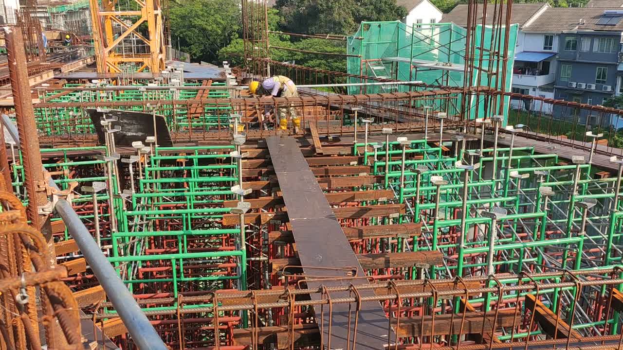 Construction Workers Fabricating Steel Reinforcement Bar - Timber ...