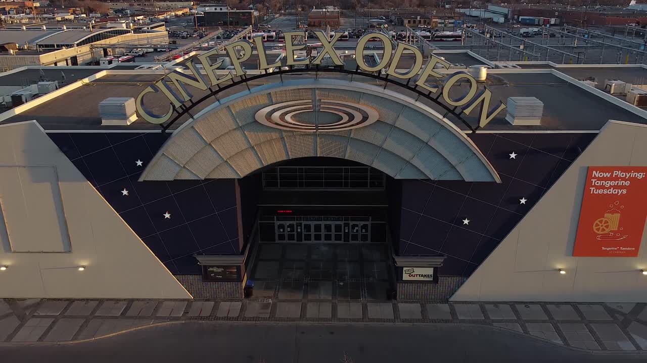 Close Up Reveal Of Cineplex Odeon Movie Theatre Cinema Exterior With ...