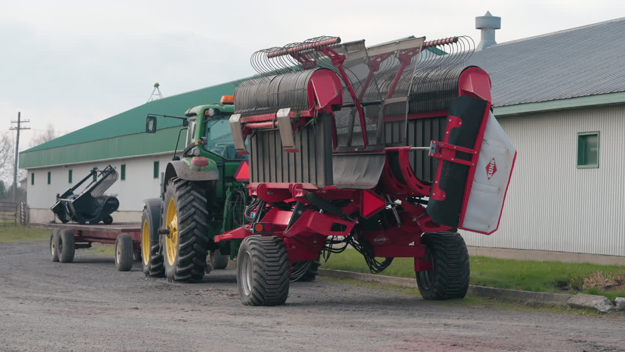 Hay Merger Tractor Parked Outside A Farm House At Daytime Free Stock ...