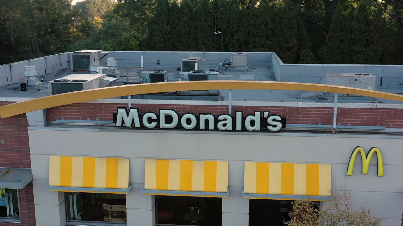 Rising Drone Orbit Of The Front Exterior Facade Of A McDonald's ...