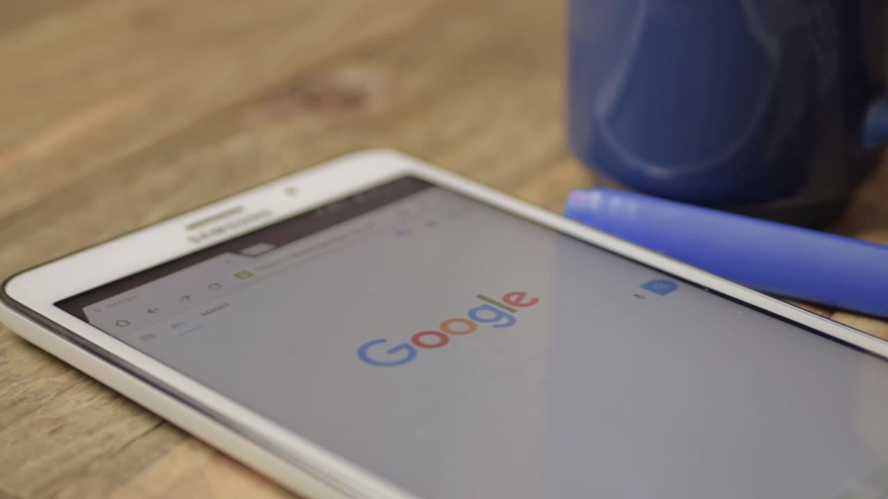 Google Homepage And Logo Displayed On Tablet With Drink And Pen Free ...
