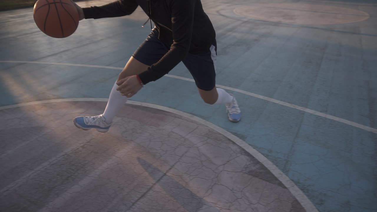 Free stock video - Female basketball player in shorts and white socks ...