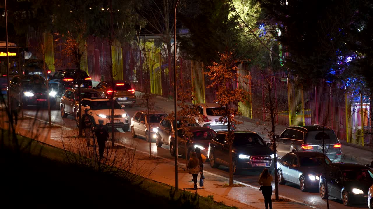 Tirana Nighttime Bustle: Cars And People In The Traffic After An ...