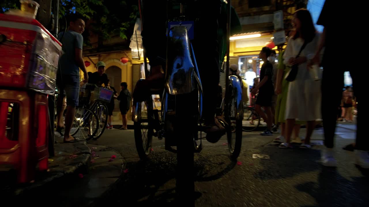 A Dynamic Low-angle Following Footage Of One Of Vietnam's Cyclos Or ...