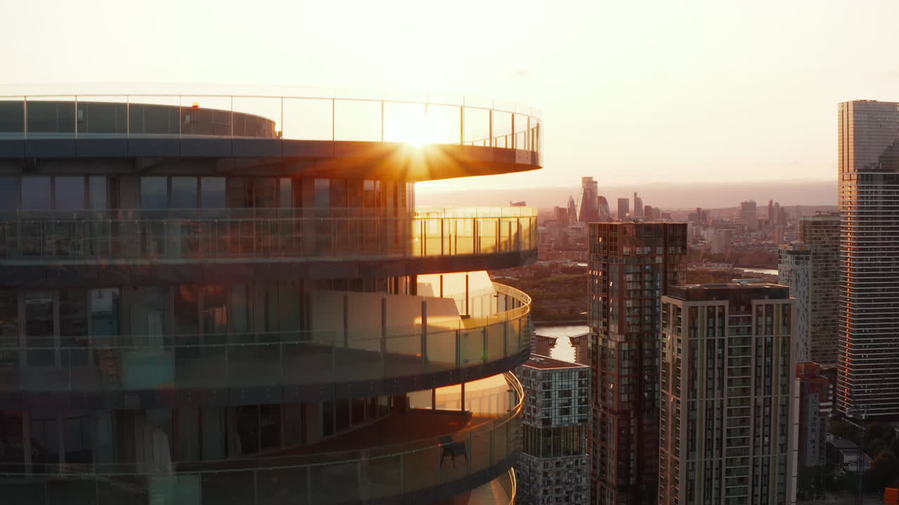 Ascending Shot Of Tall Modern Round Apartment Building With Rings Of ...