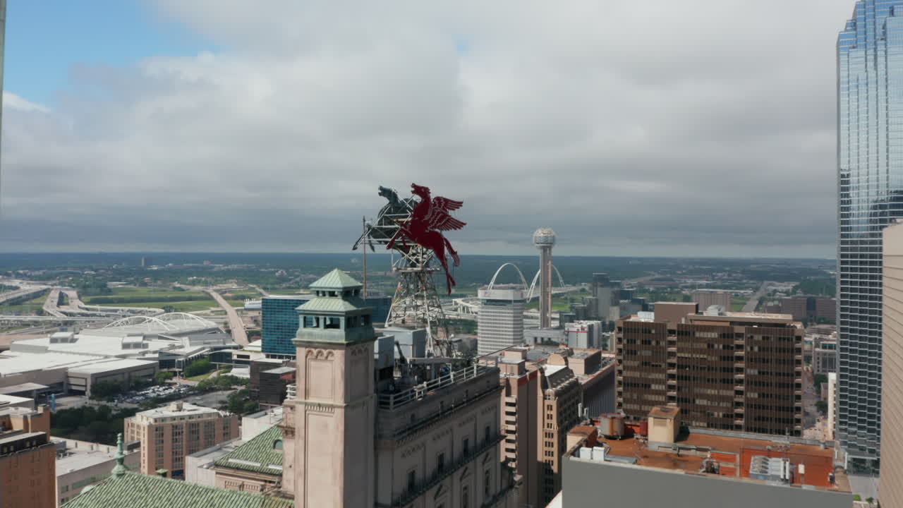 Forwards Ascending Fly To Pegasus On Roof Of Magnolia Building. Two Massive Red Sculptures On ...