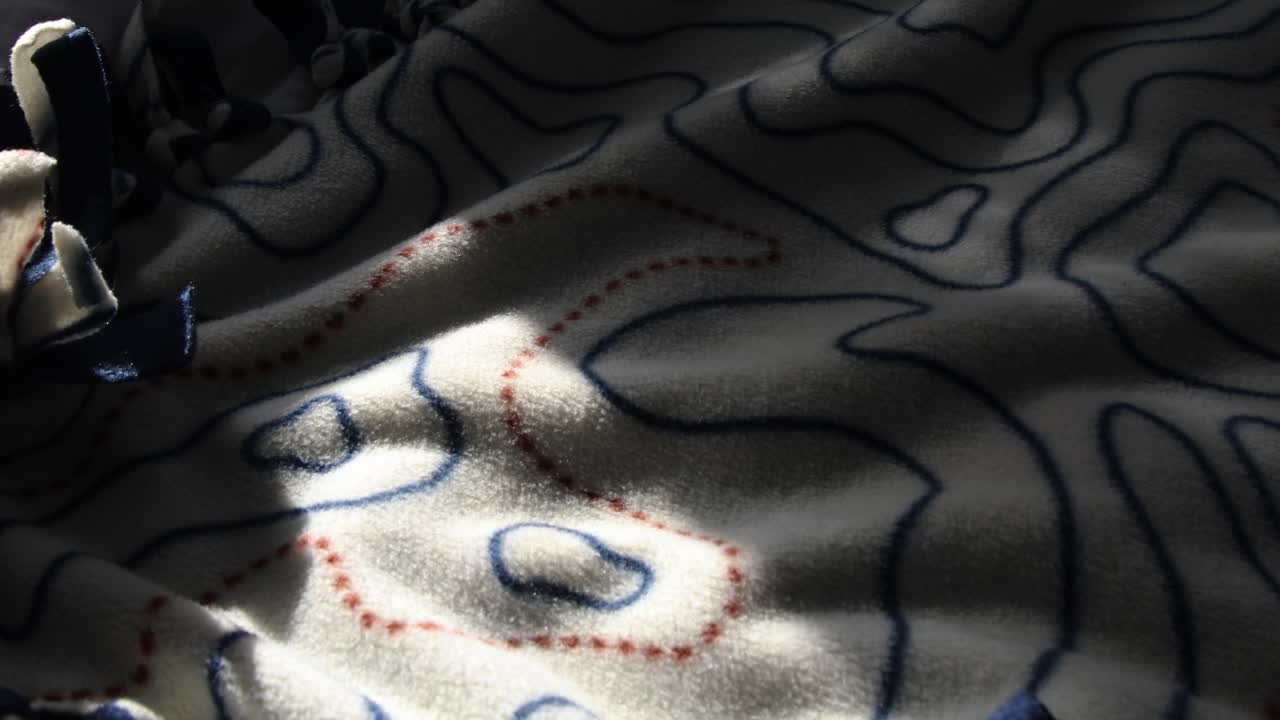 Cool Topographic Design On A Bed Throw With Dramatic Lighting And ...
