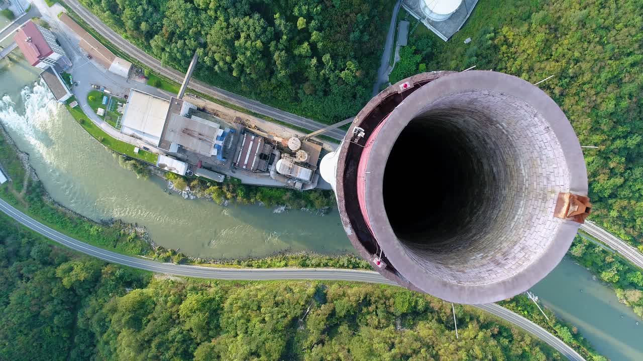Premium stock video - Dramatic ascending aerial view over the chimney ...