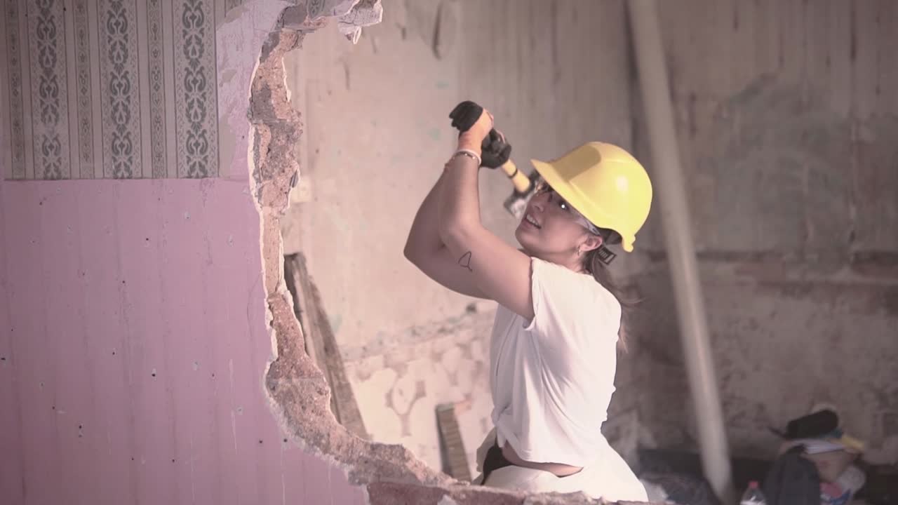 Premium stock video - Slow motion video of a young construction worker ...