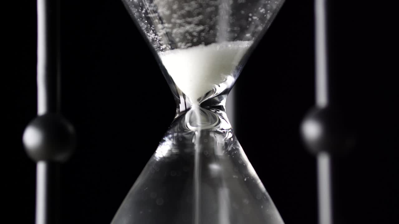 Detailed View Of White Sand Falling Through Tiny Gap In Middle Part Of ...