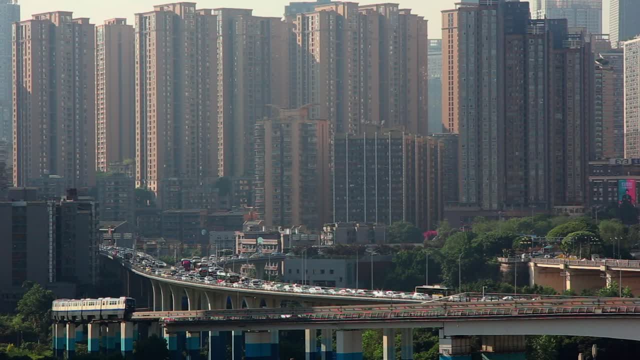 Premium stock video - Crowded road and metro train passing by in the ...