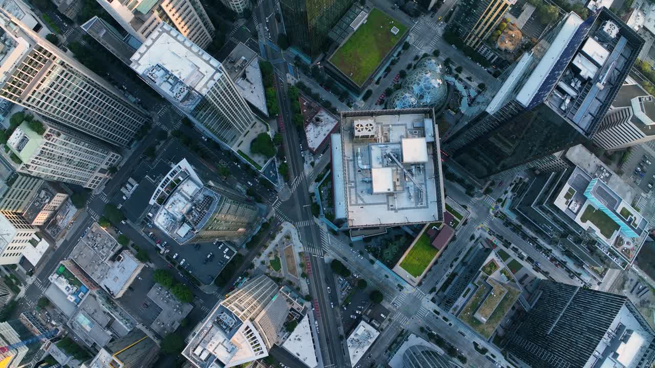 Premium stock video - Overhead aerial view of skyscrapers looming over ...