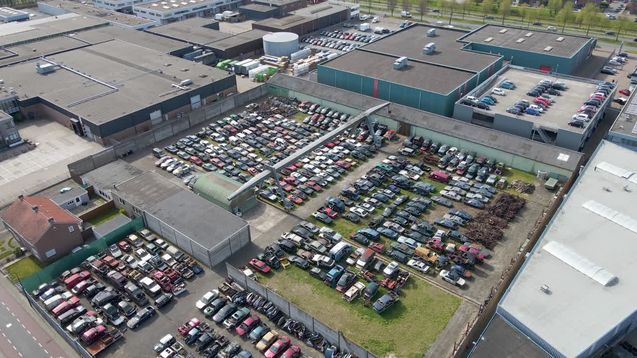 Premium stock video - Aerial of large junk yard filled with old car wrecks