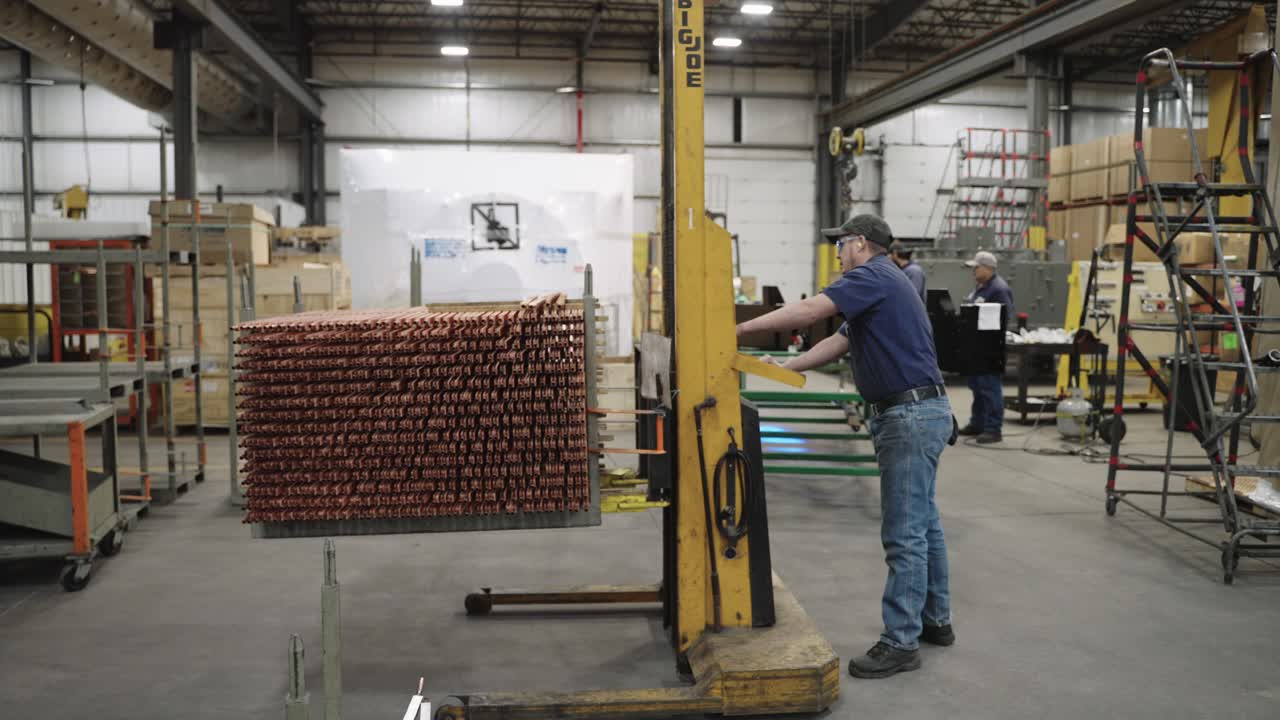 Blue Collar Worker Moving Steel Metal Rebar On A Forklift In Warehouse ...