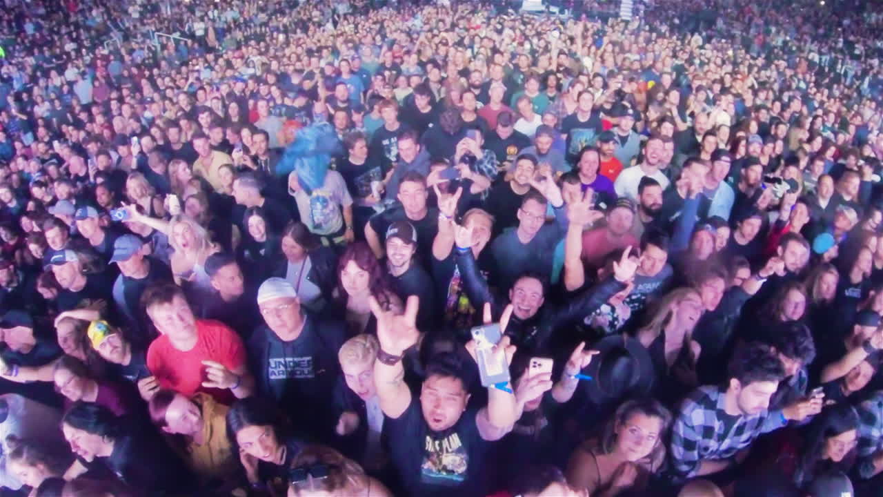Spectators Crowd In Front Of Stage Cheering At Rock Music Concert Show ...