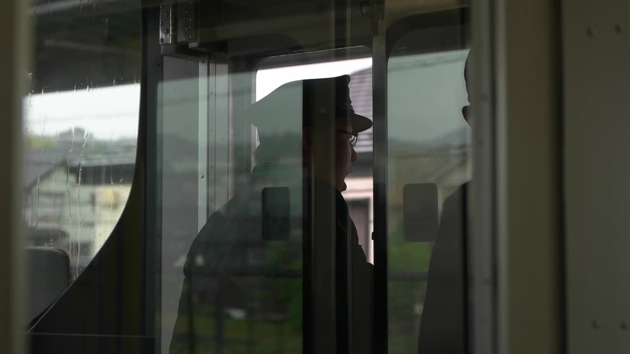 View Looking Through Reflective Glass Of Japanese Train Conductor ...