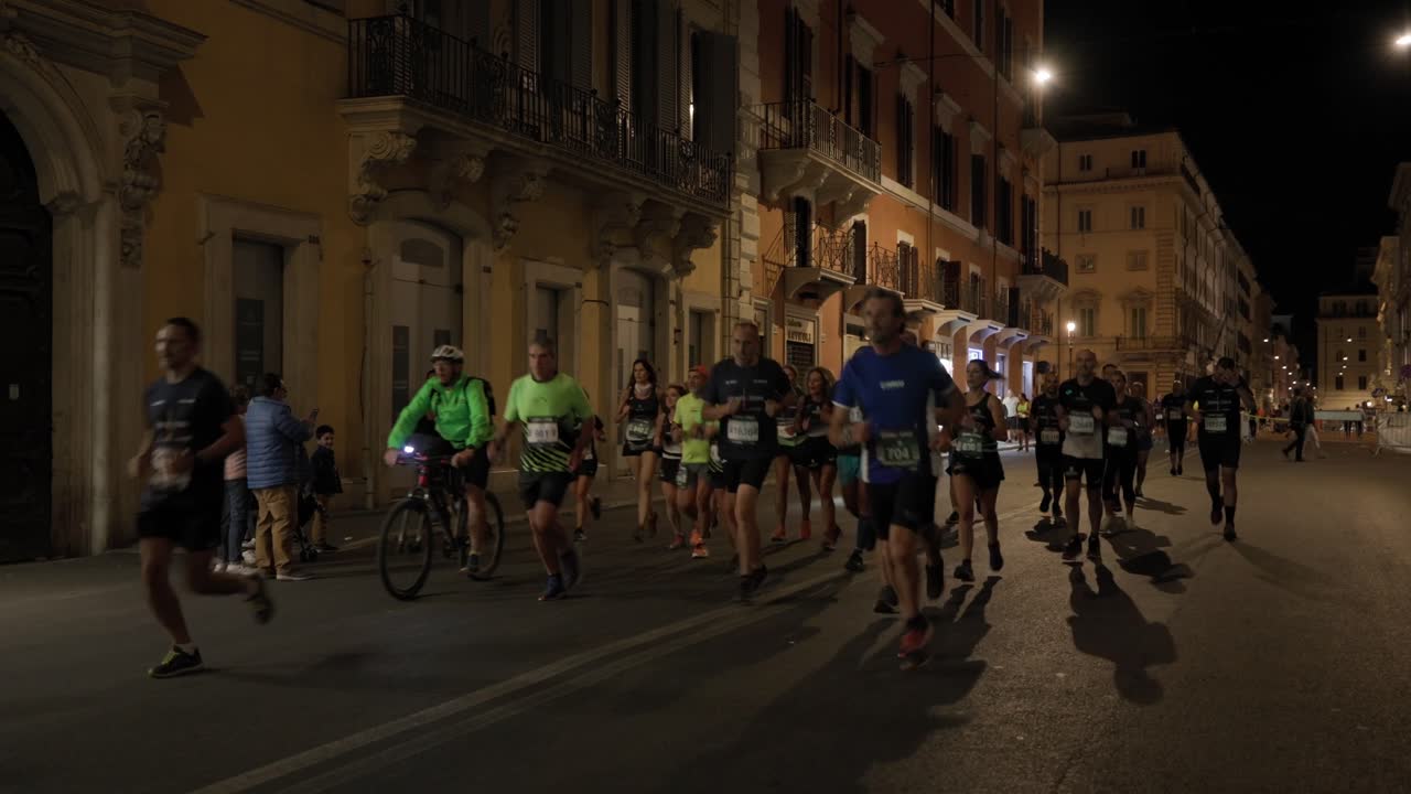 Runners Taking Part In The Marathon Running In The Early Morning In ...