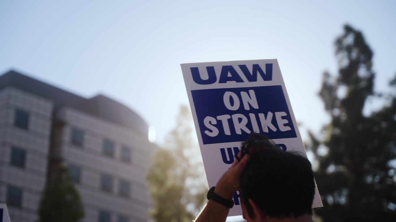 : A "UAW On Strike," Sign Held High On The Picket Line At The UC ...