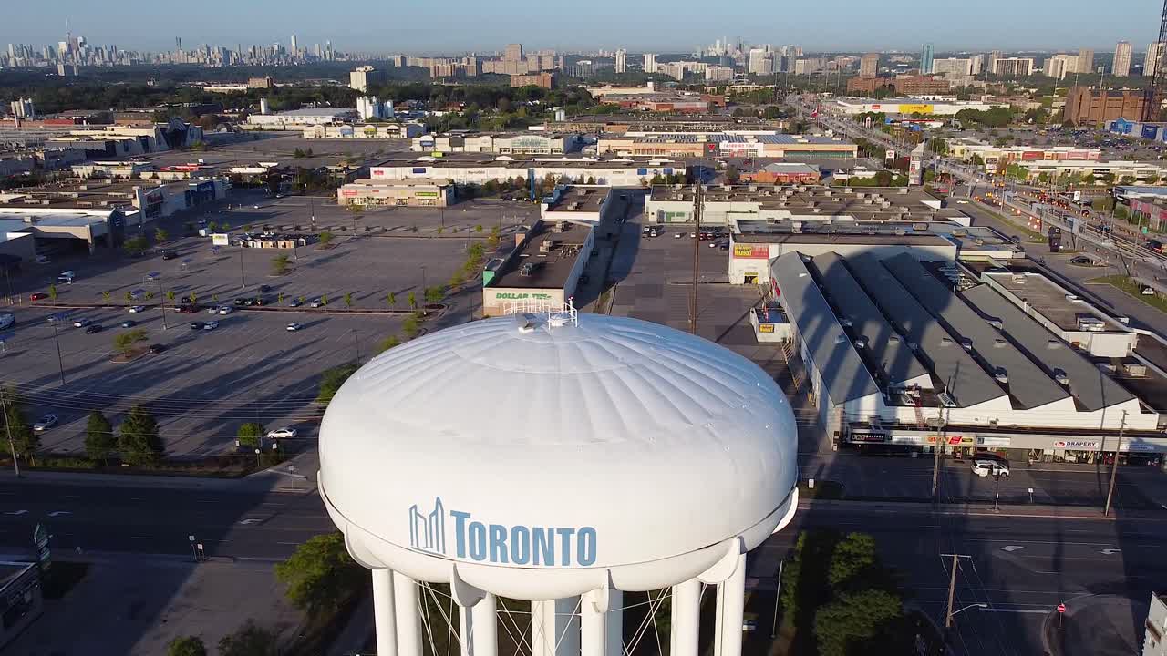 TTC Bus Driving By Toronto Water Tower In Golden Mile With Downtown ...