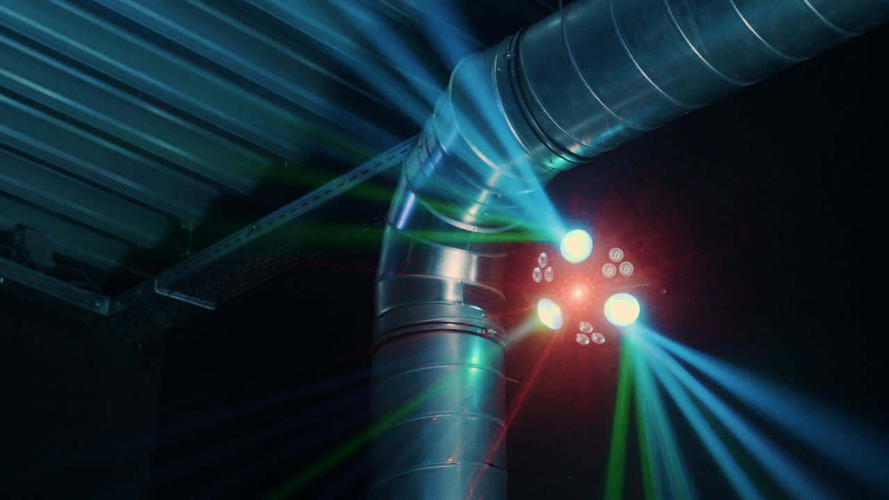 Premium stock video - Cool laser in a industrial setting changes lights ...
