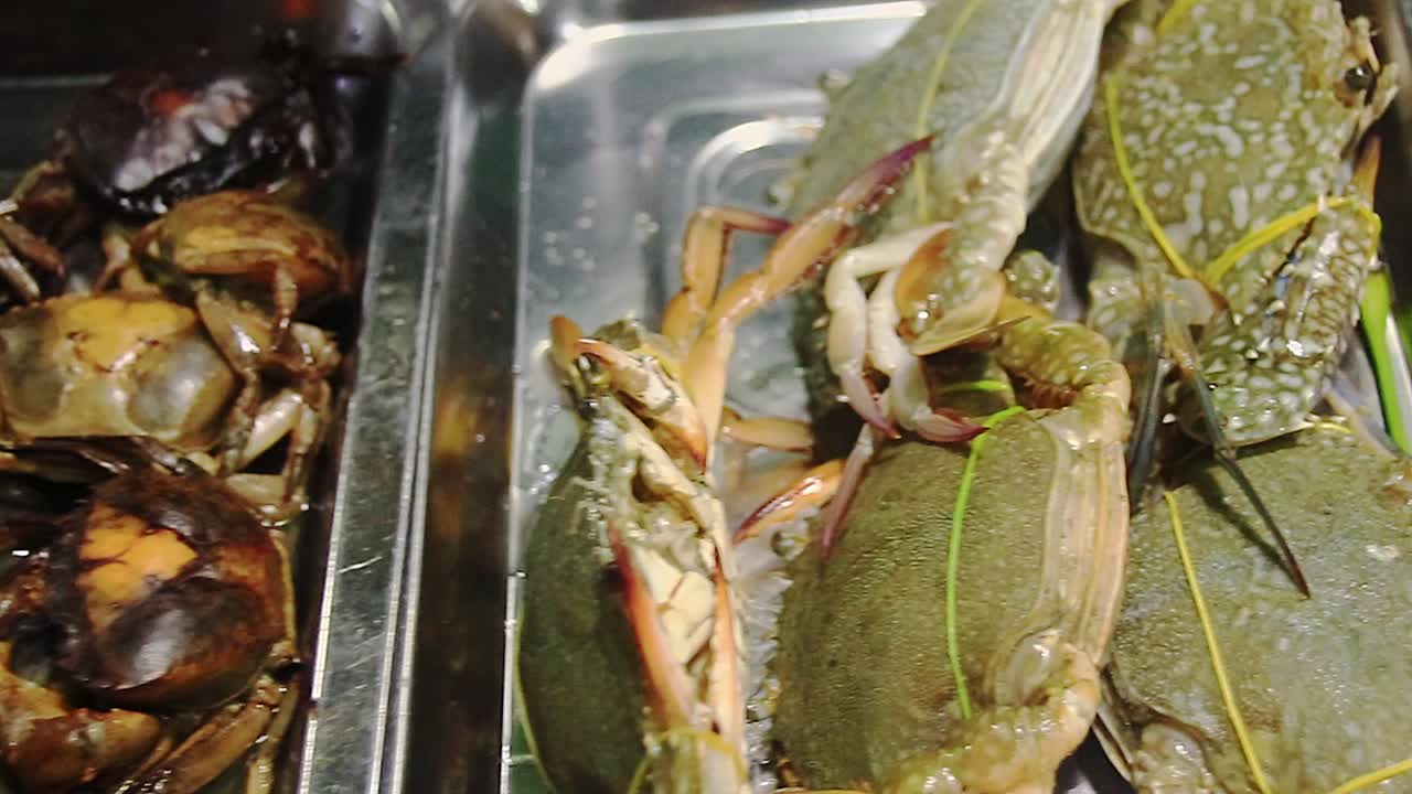Sea Crabs And Land Crabs Displayed For Grilling At A Street Food Stall ...