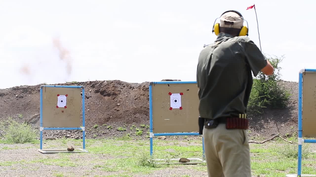 Ranger-Guide Target Practice Shoots Large Rifle In Madikwe, S Africa ...