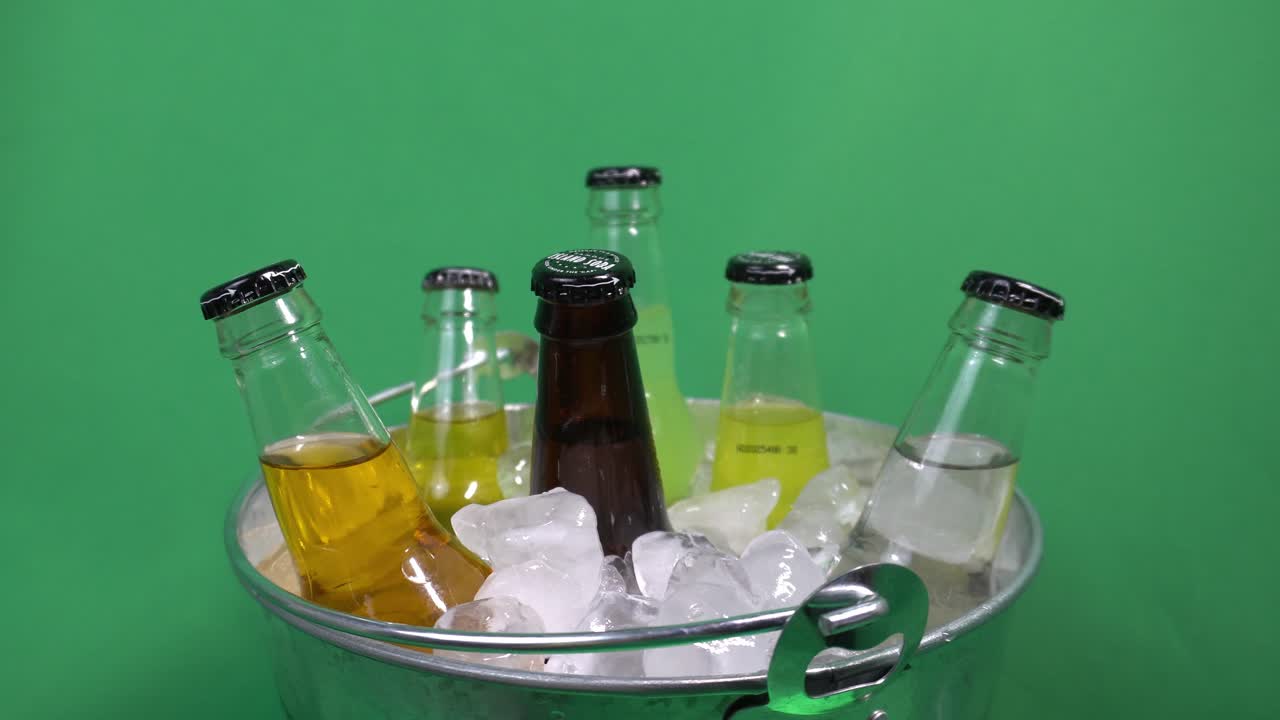 Assorted Island Soda Glass Bottles Rotating In Front Of A Green Screen ...