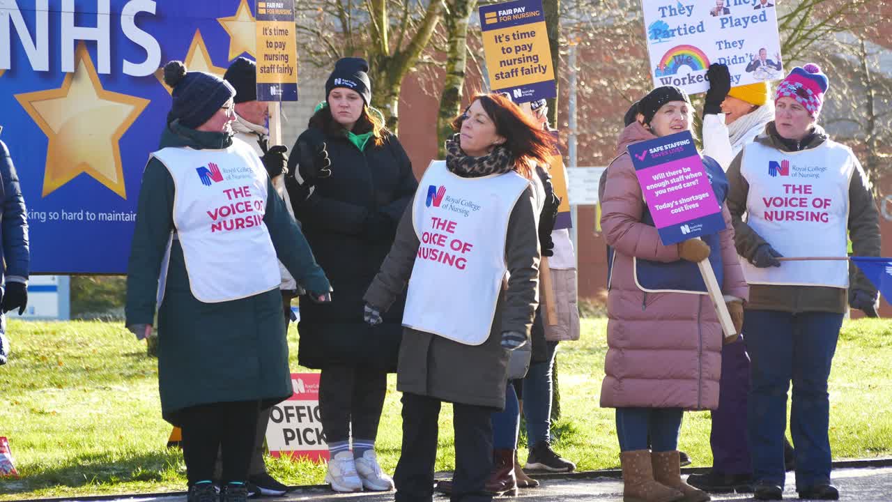 NHS Staff Nurses Strike For Fair Pay, Waving Banners And Flags Outside ...