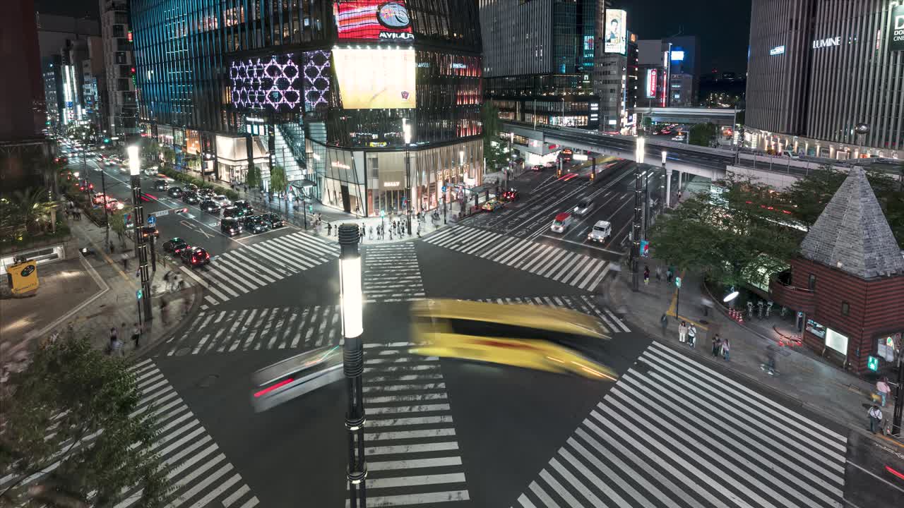 Sukiyabashi Crossing At Night With Vehicles And People Crossing The ...