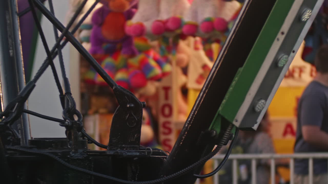 Center Of Spinning Carnival Ride At Dusk With Flashing Lights, Close Up ...