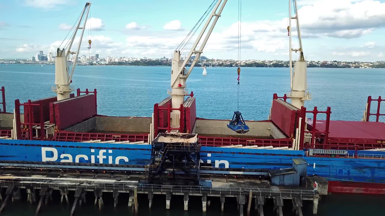 Aerial Pan Of Cargo Ship Crane Offloading Sugar In Chelsea Sugar ...