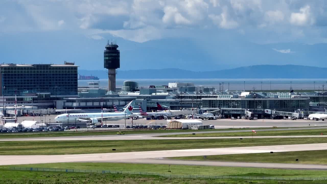 Airplanes On The Airfield And Air Traffic Control Tower Of YVR ...