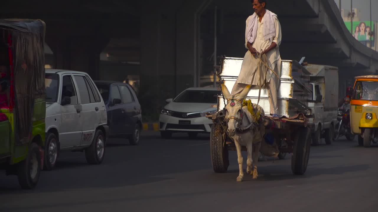 A Donkey Car Is Going On The Road, Traffic Close Up At The Road Under The Fly Over, Passing ...