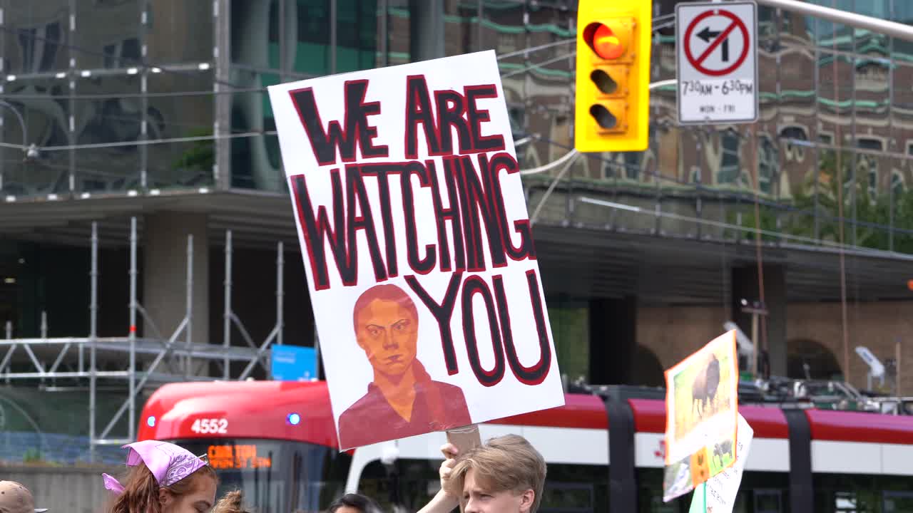 Man Holding Up Greta Thunberg Sign During Global Climate Change March ...