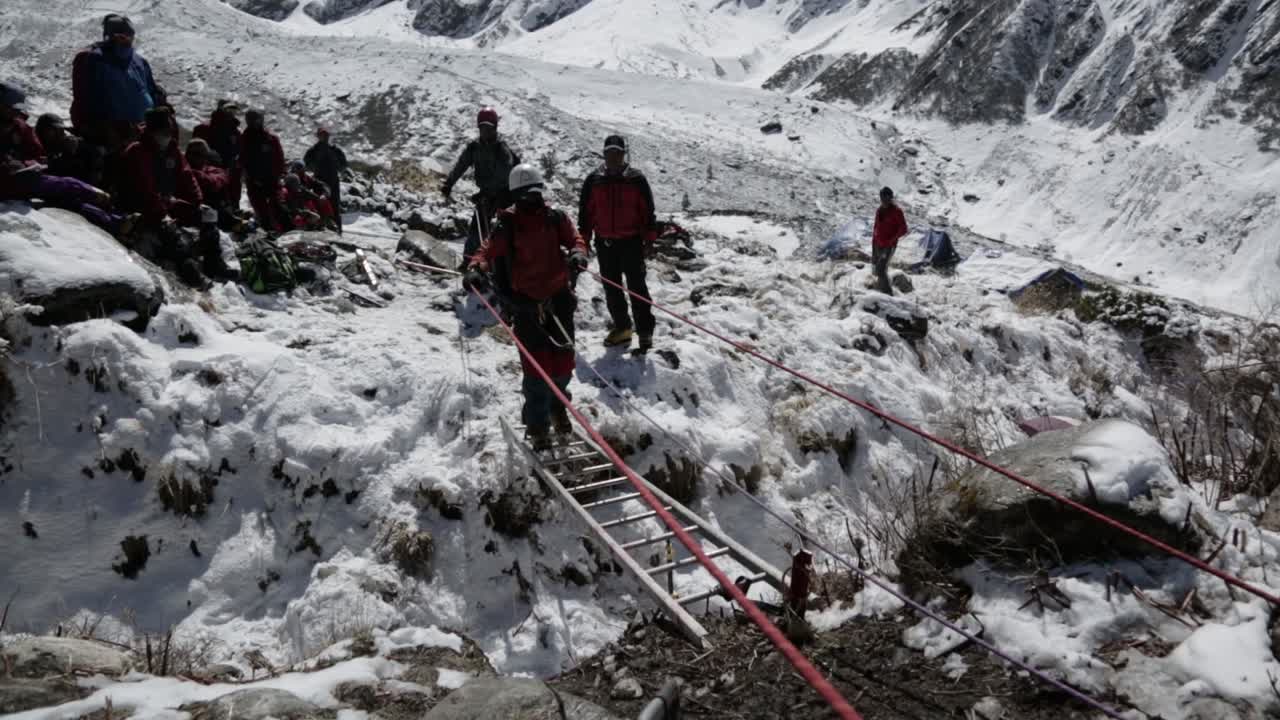 A Himalayan Mountaineer Crossing Caravans By Ladder Crossing Free Stock ...