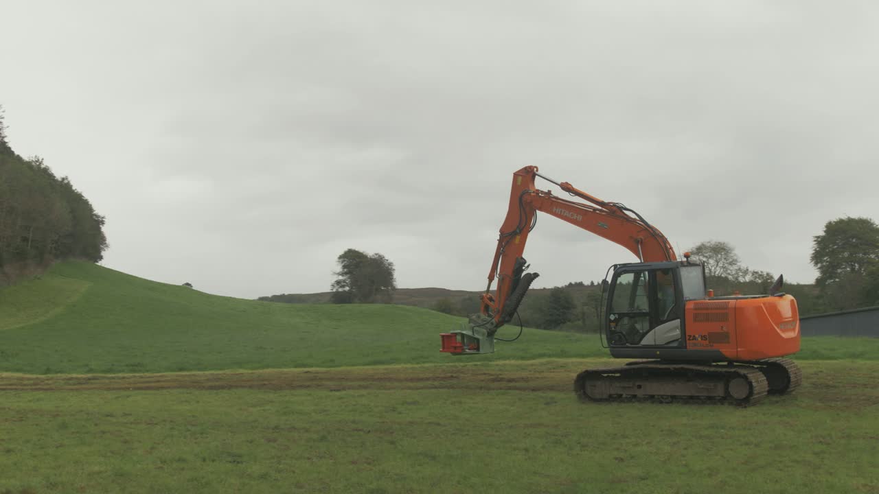 Tree Shear Attachment On Digger Excavator Enters Field Driving Towards ...